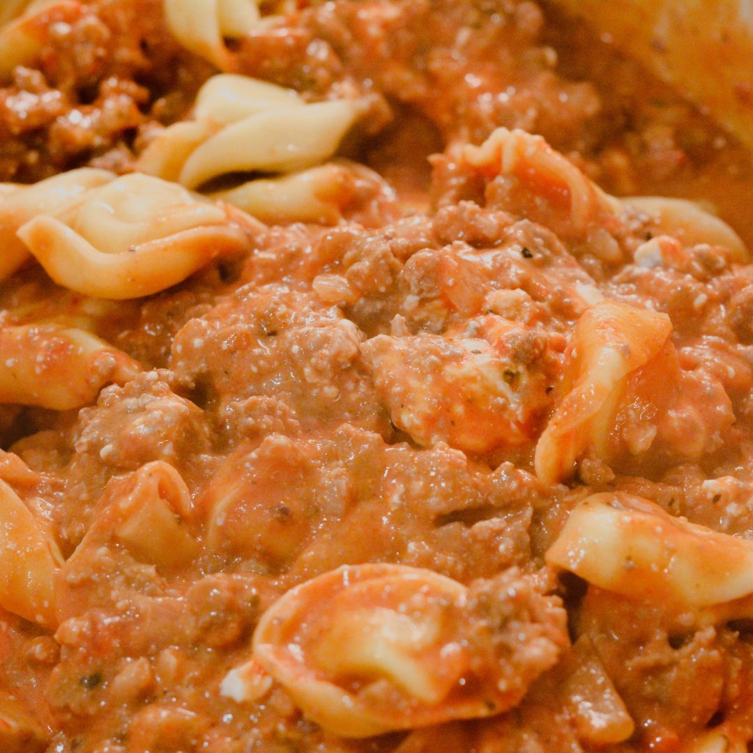 In a large Dutch Oven, pour the spaghetti sauce of the meat. Heat up ...