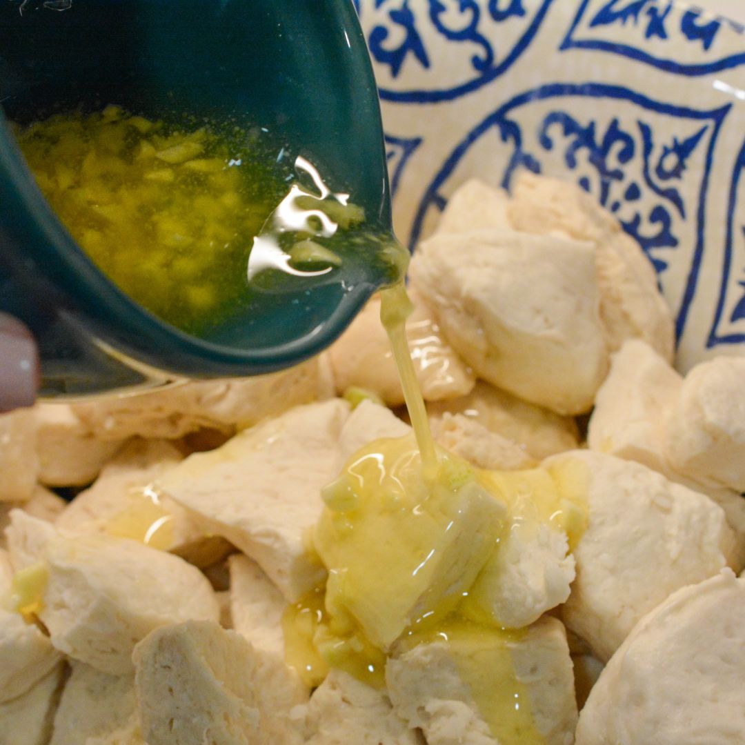 Pop Open The Cans Of Biscuits And Removing Them From The Can Then Cut Into Four Quarters Put